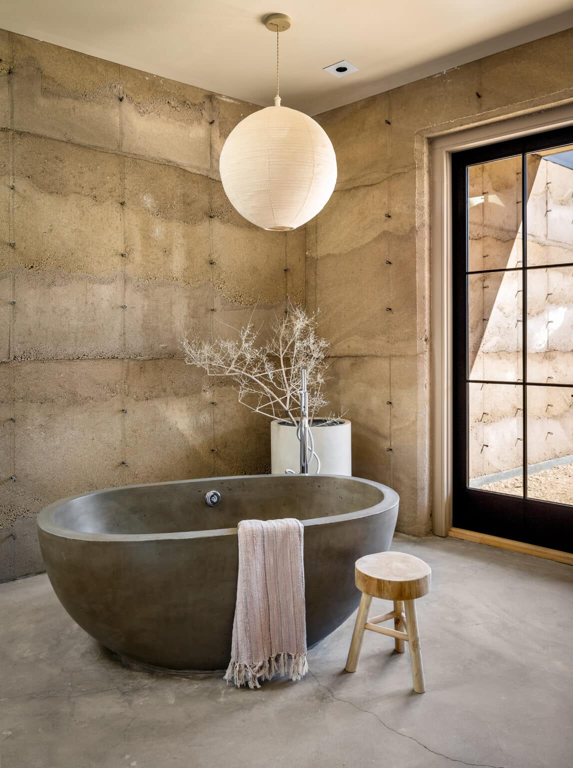 Go Inside 1 Rammed Earth Home with a NativeStone Tub